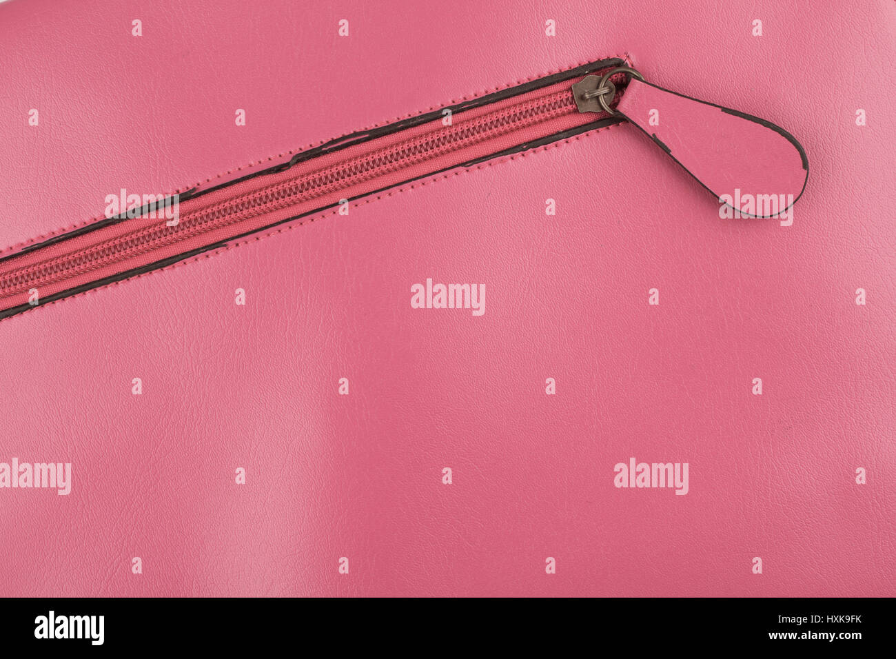 horizontal detail of bag zipper on pink leather background Stock Photo ...