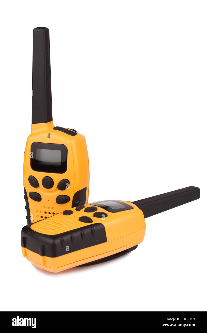 front view of a pair of yellow walkie talkie with black keypad isolated ...