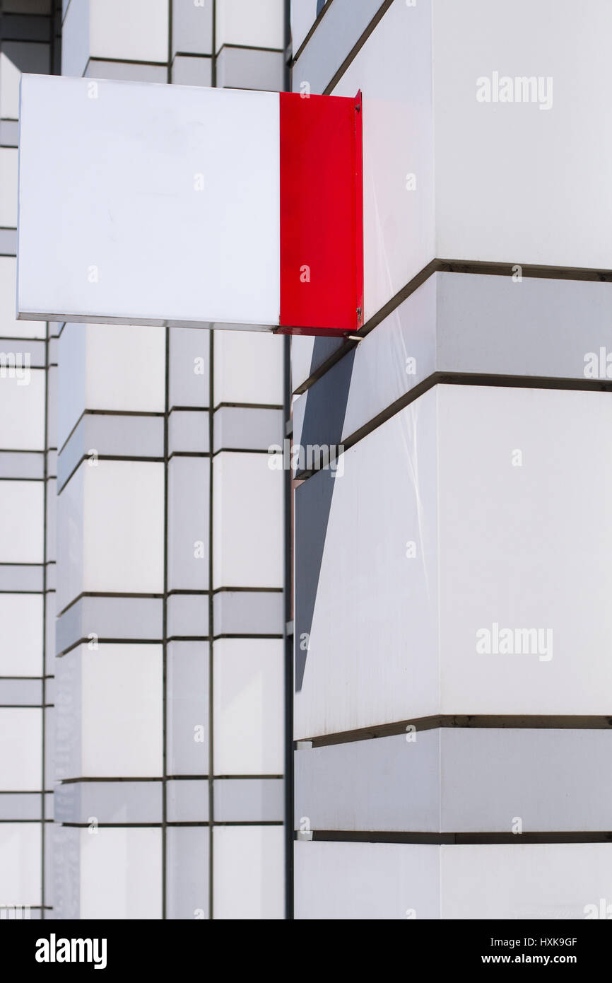 vertical side view of empty white square signage on the exterior of a ...