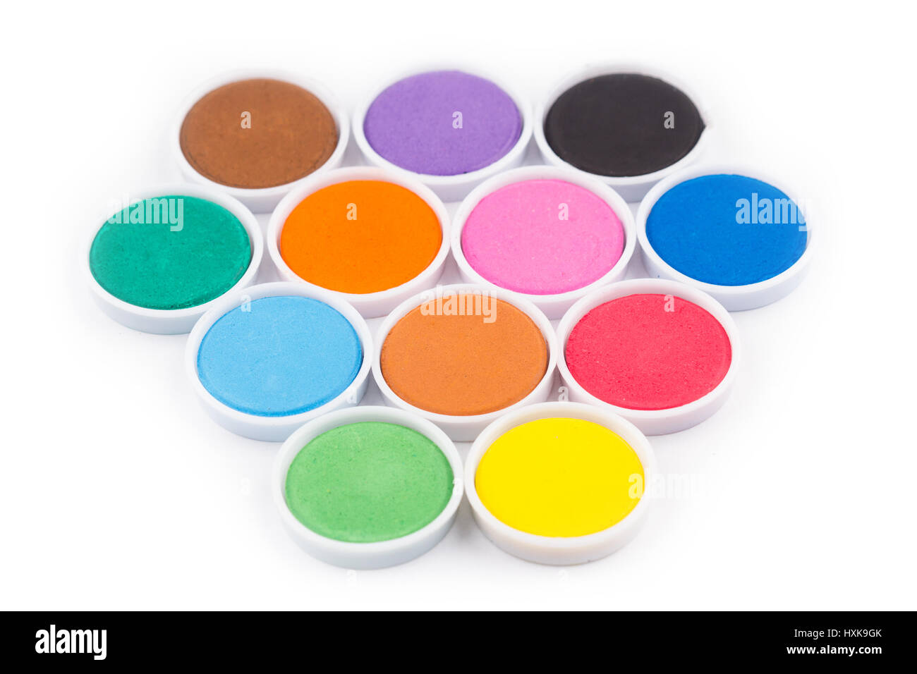 low angle closeup of water color palette in white plastic containers ...