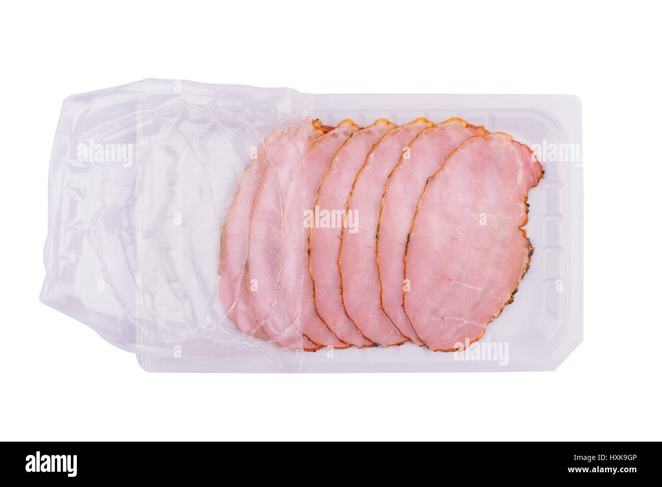 top view of slices of smoked pork loin ham in open transparent plastic ...