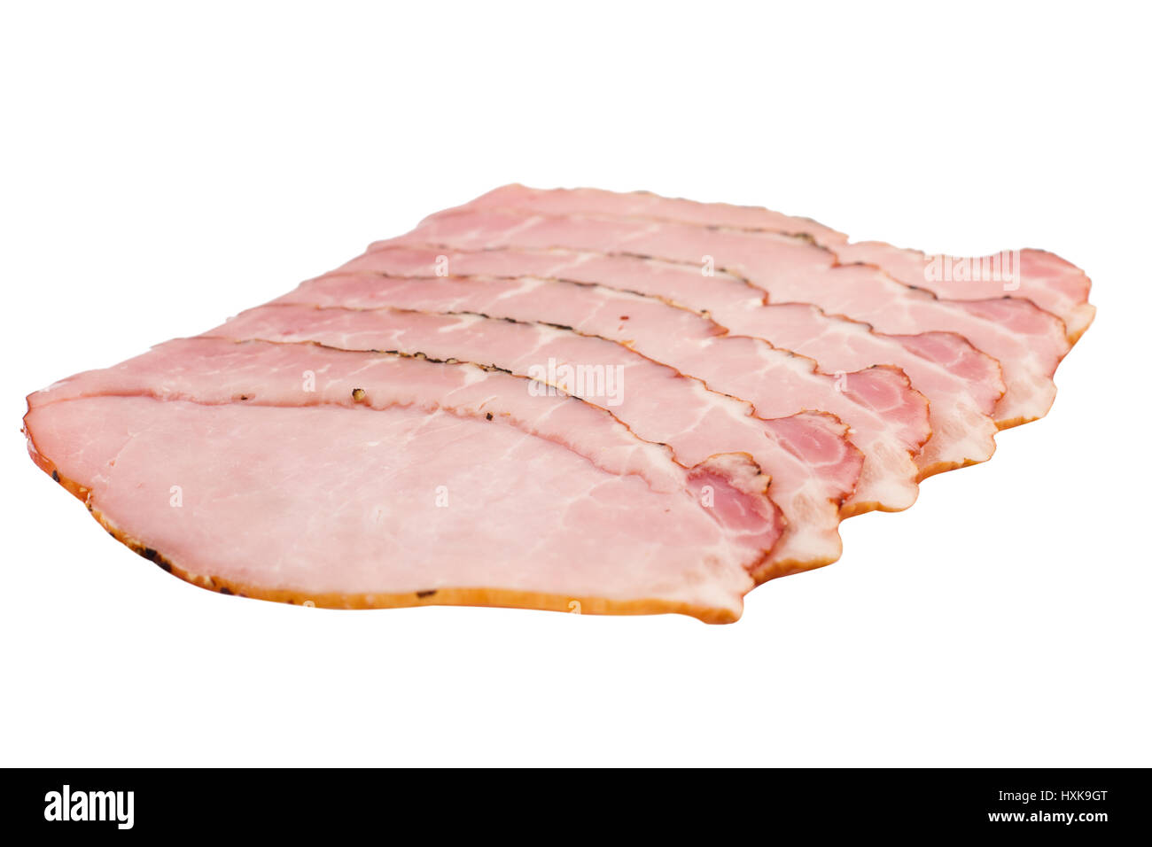 low angle side view of slices of smoked pork loin ham arranged in a ...