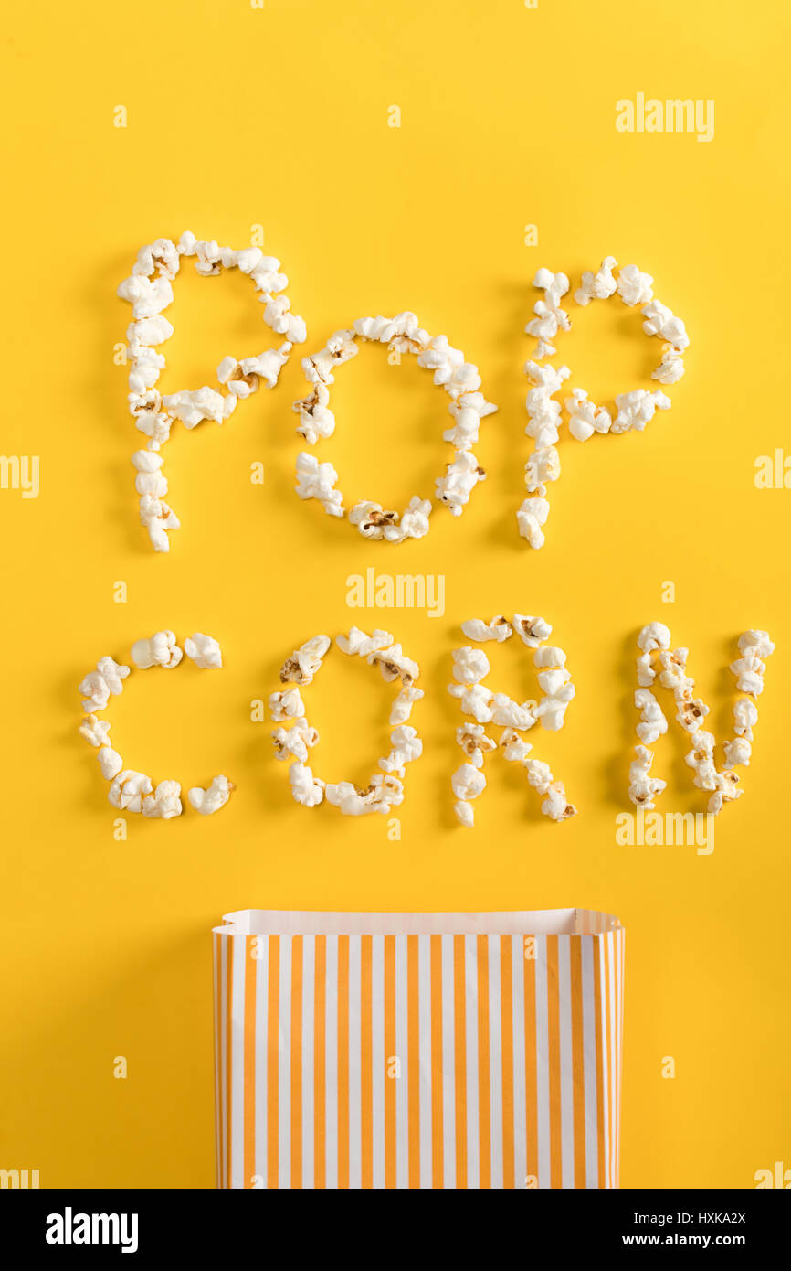 Top view of Pop corn lettering made from popcorn on yellow Stock Photo ...
