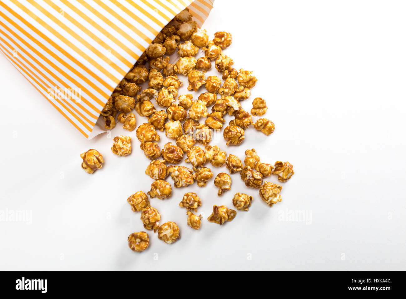 close up view of popcorn in paper container on white Stock Photo - Alamy