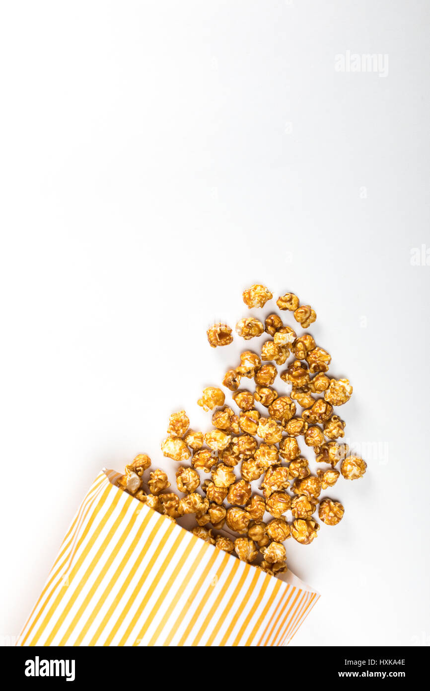 top view of popcorn in paper container on white Stock Photo - Alamy