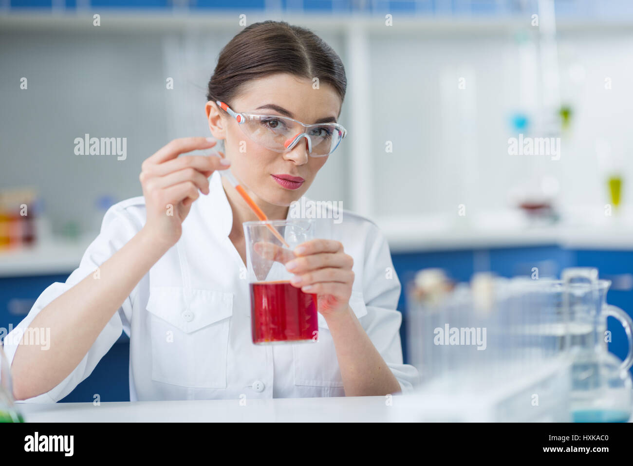Chemical lab flask woman hi-res stock photography and images - Alamy