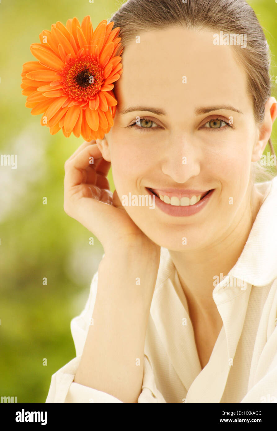Young woman with flower Stock Photo - Alamy