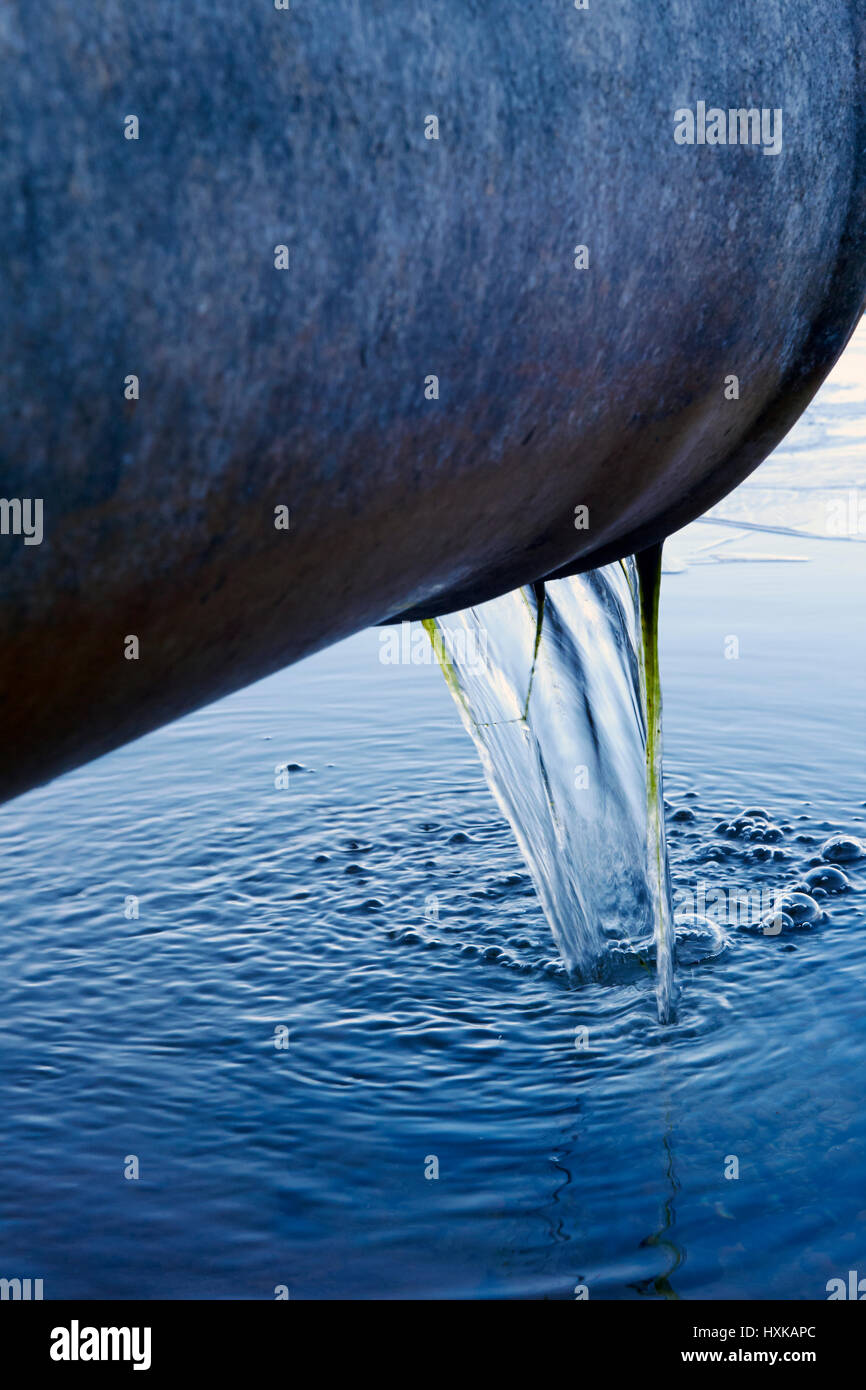 water running out of drain pipe into lake, Finland Stock Photo - Alamy