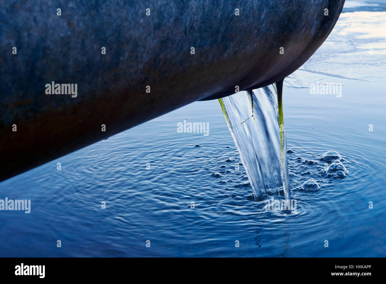 water running out of drain pipe into lake, Finland Stock Photo - Alamy