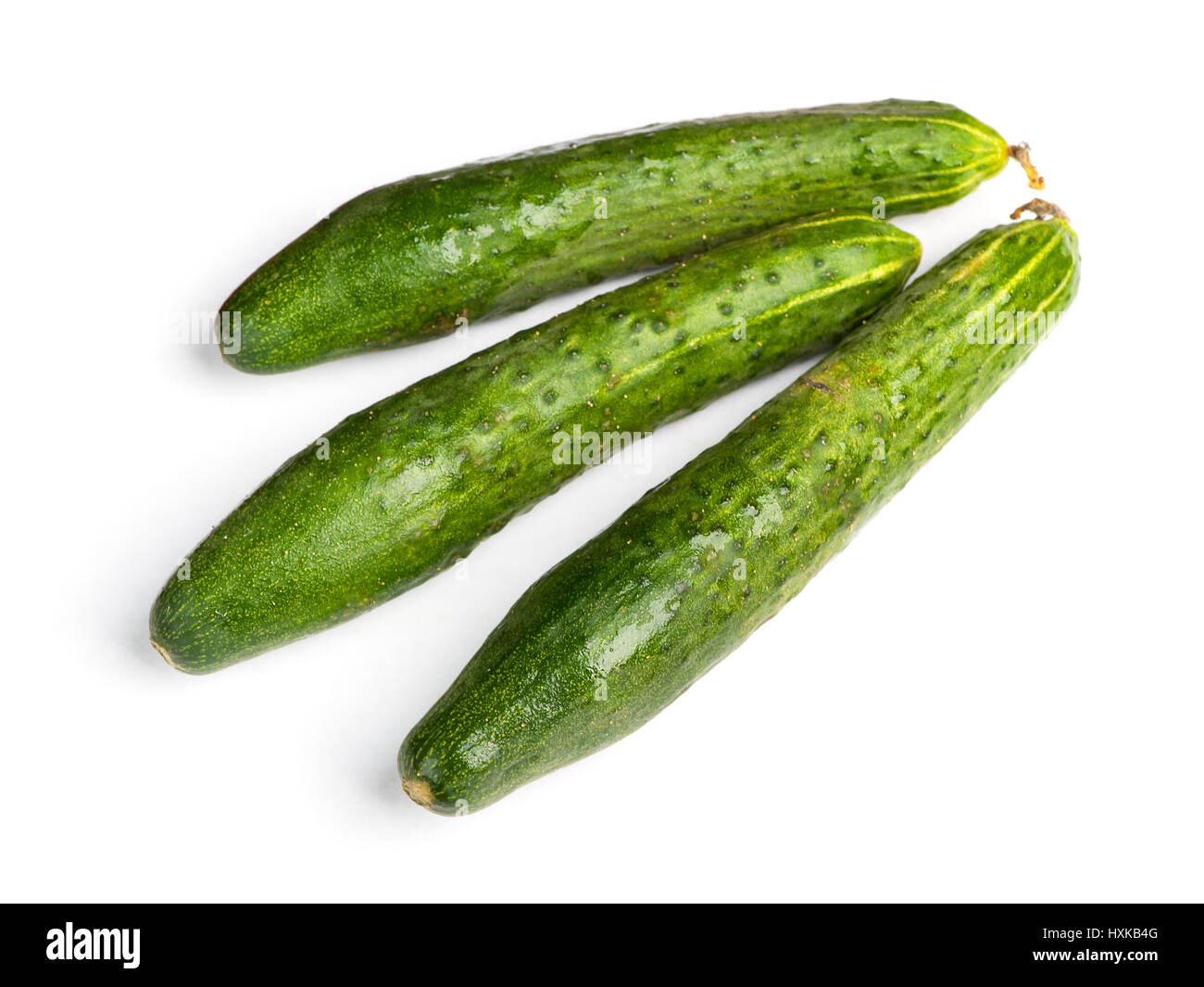Fresh long cucumbers isolated over white background Stock Photo - Alamy