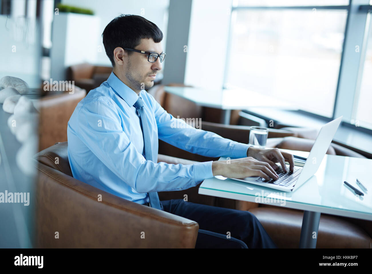 Young Trader Working on Laptop Stock Photo - Alamy