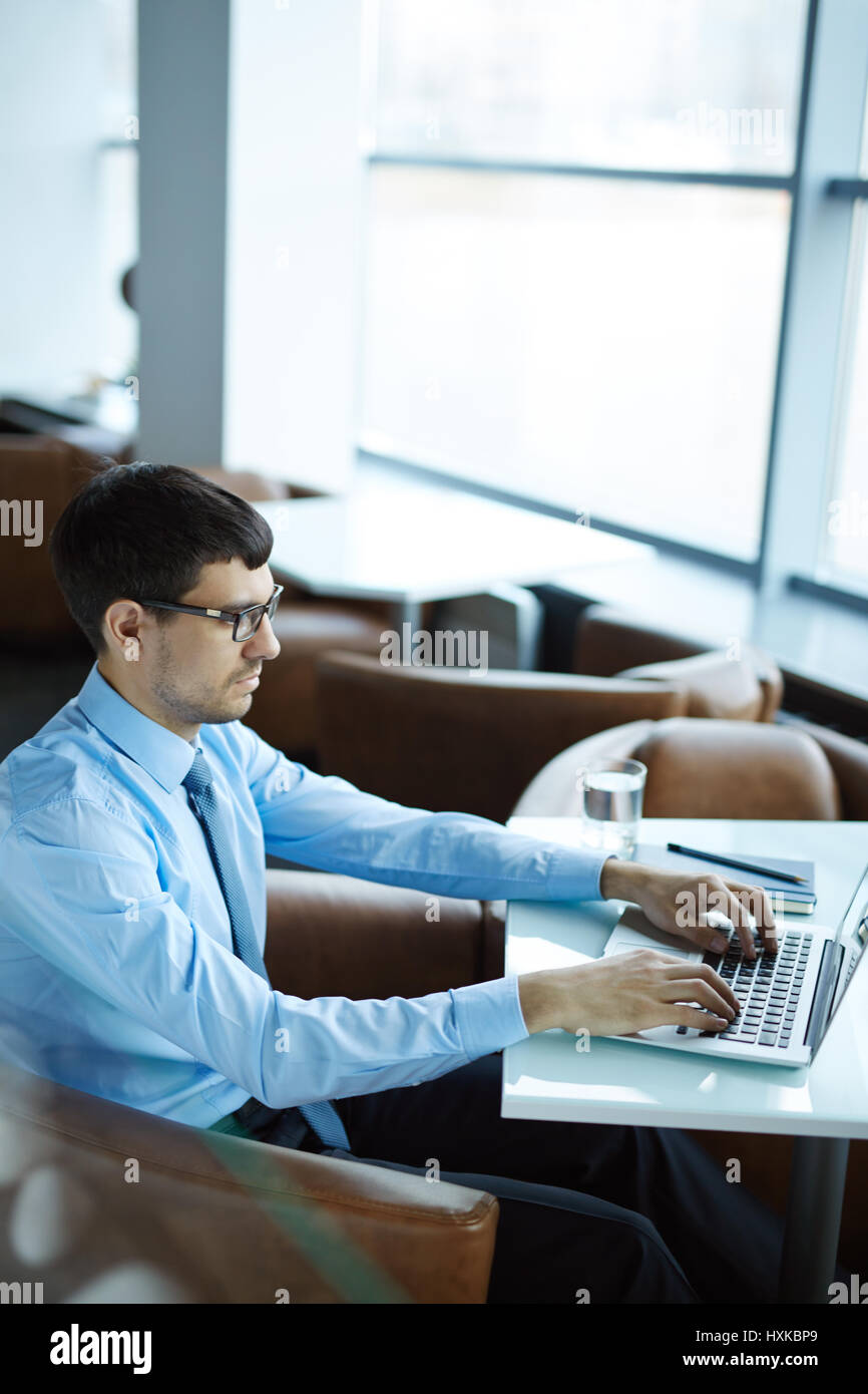 Young Businessman Checking Emails Stock Photo - Alamy