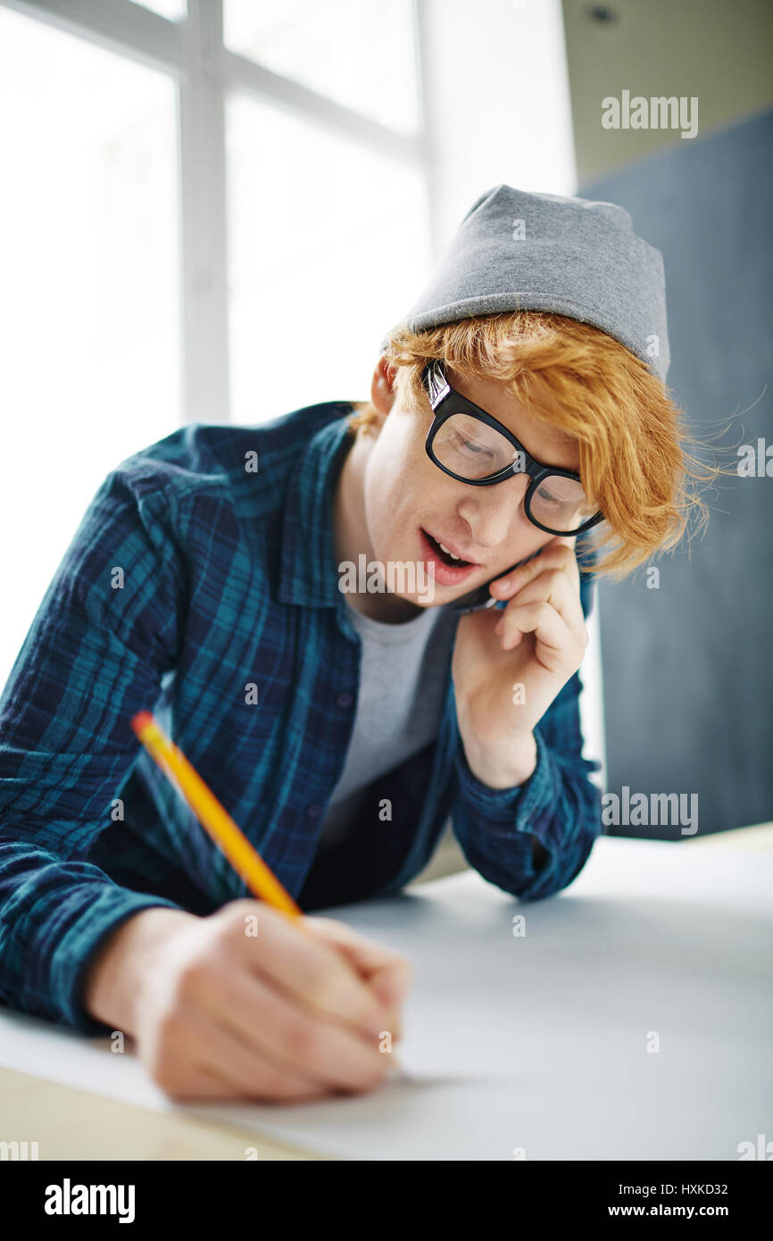 Creative Student Speaking on Phone Stock Photo - Alamy