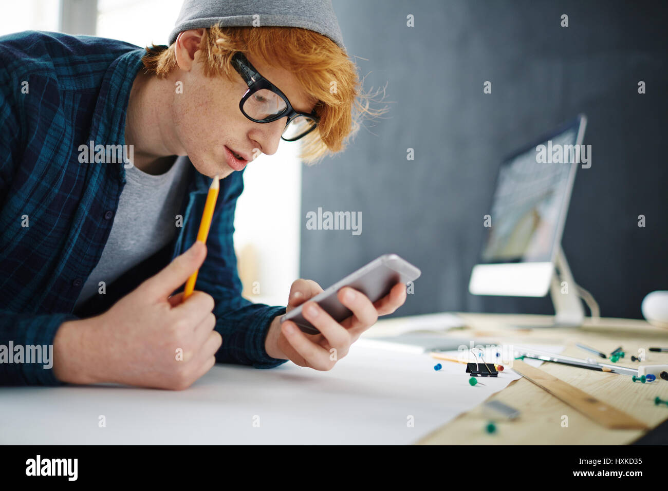 Creative Student Using Smartphone Stock Photo - Alamy