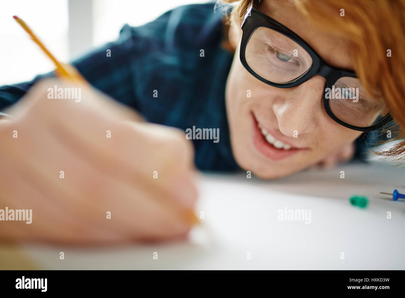 Young Red haired Man Drawing with Inspiration Stock Photo - Alamy