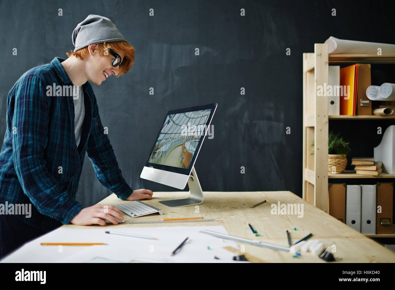 Smiling Young Architect at Workplace Stock Photo - Alamy