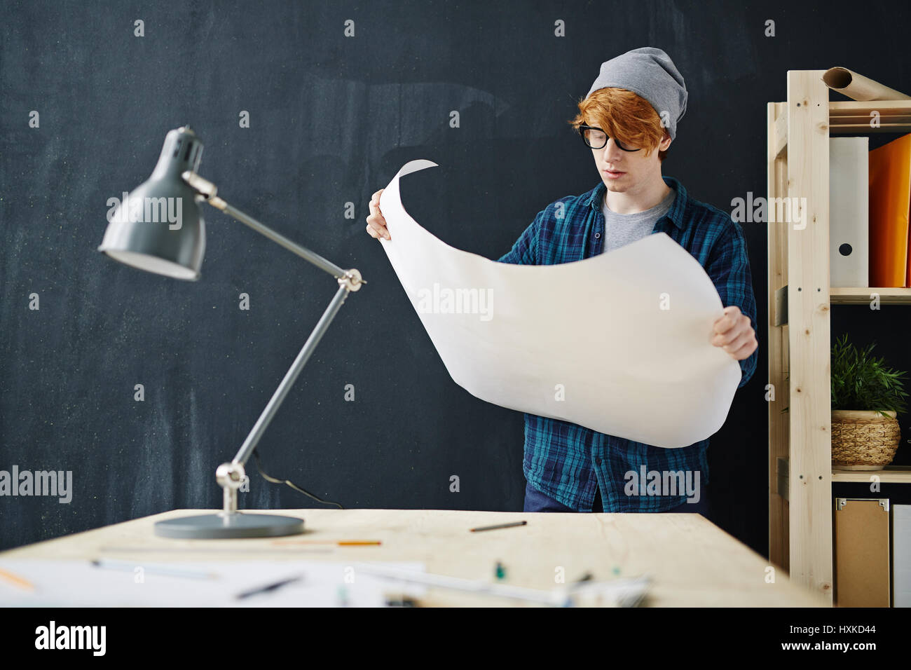 Young Modern Engineer Studying Blueprints Stock Photo - Alamy