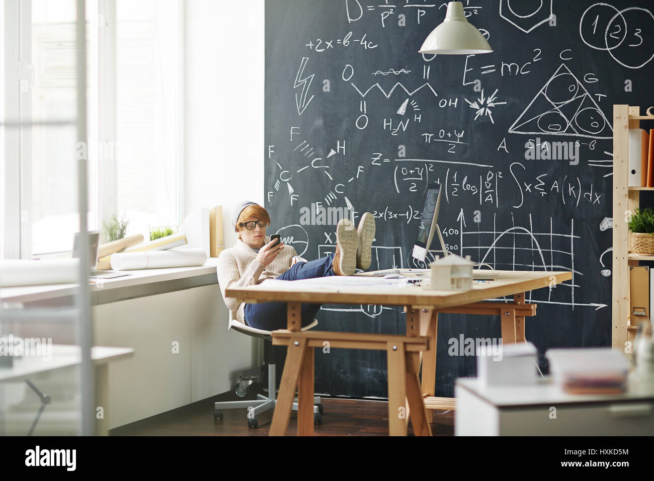 Student Relaxing In Classroom Stock Photo - Alamy