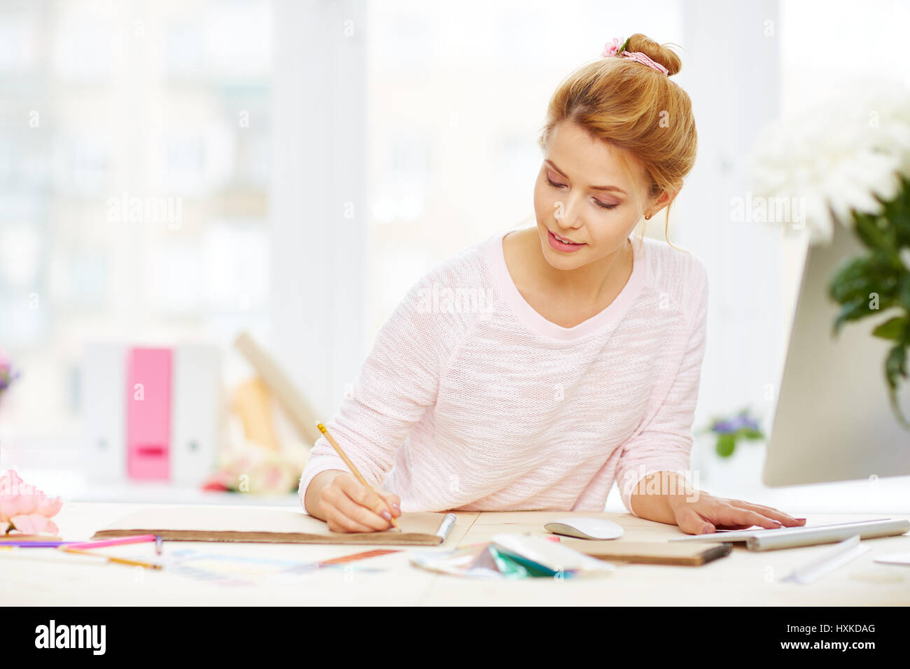 Graphic designer taking notes Stock Photo - Alamy