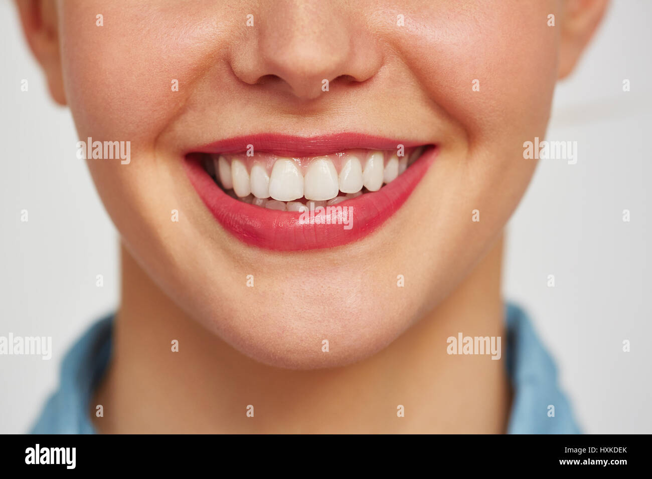 Charming smile of young woman Stock Photo - Alamy