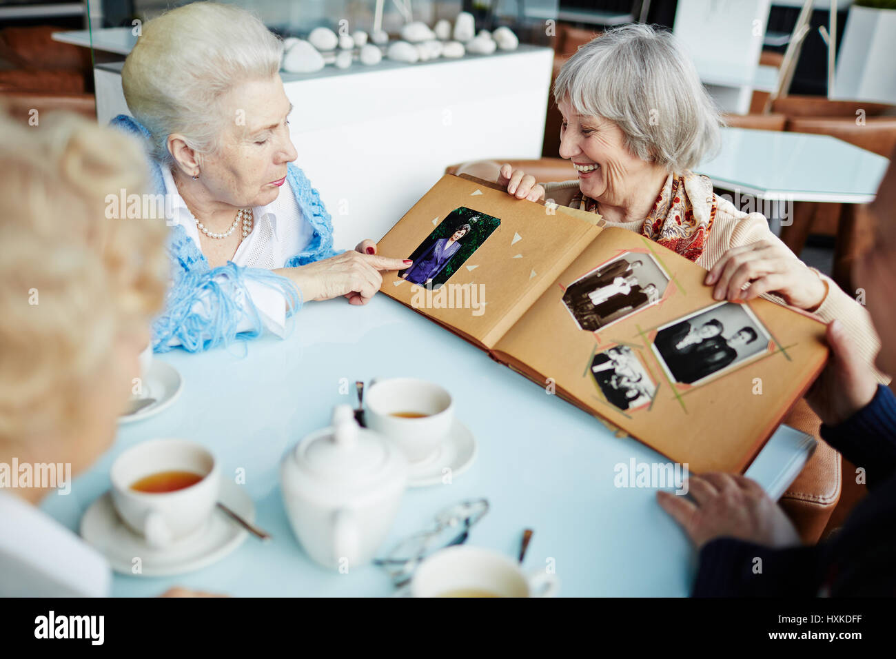 Seniors relaxing in cafe Stock Photo - Alamy