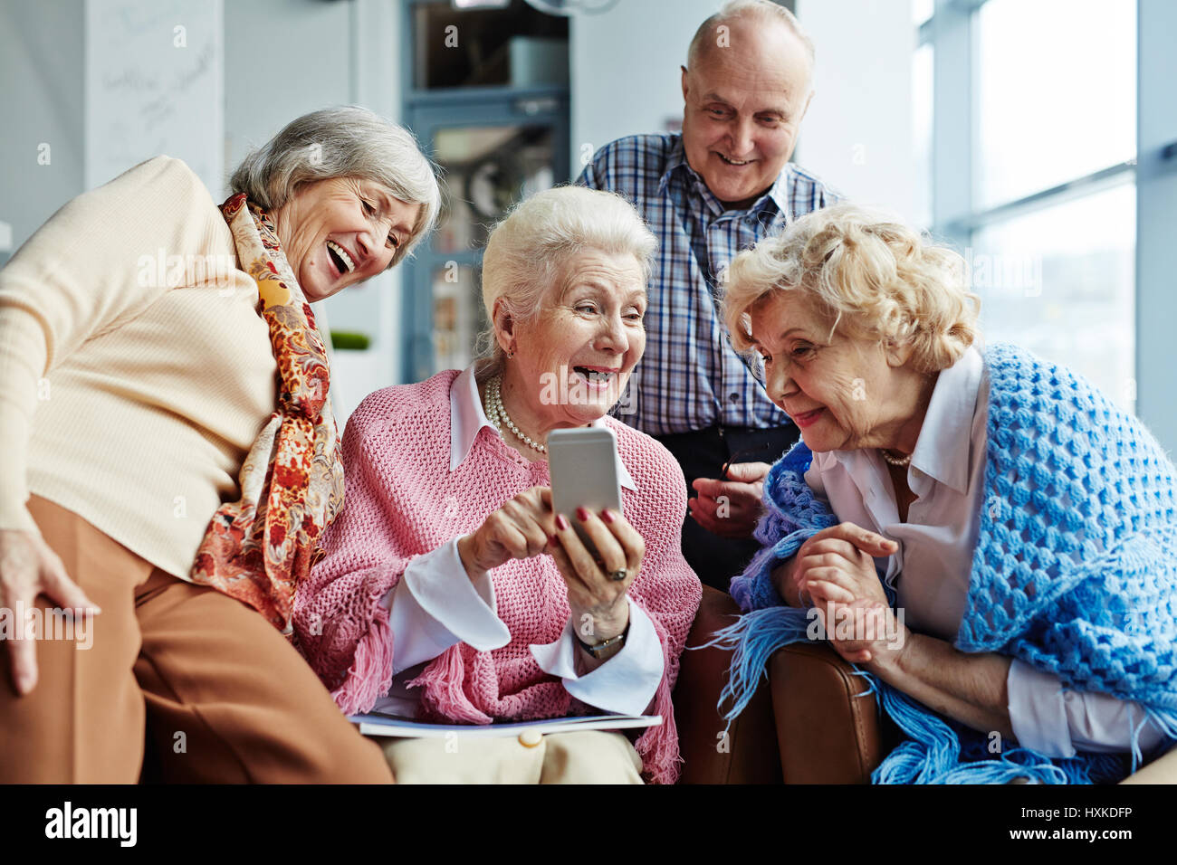 Looking through funny photos Stock Photo - Alamy