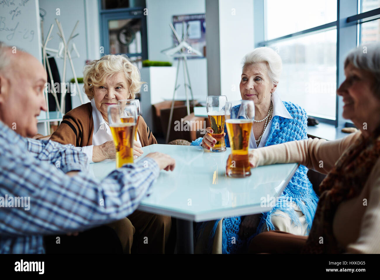 Senior friends gathered in pub Stock Photo - Alamy