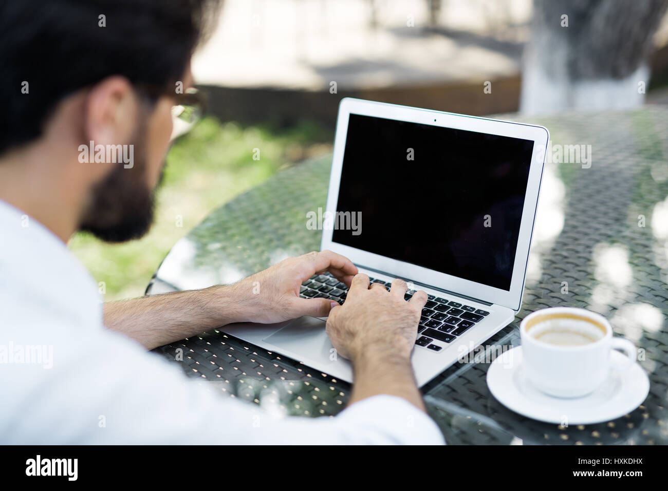 Working in outdoor cafe Stock Photo - Alamy