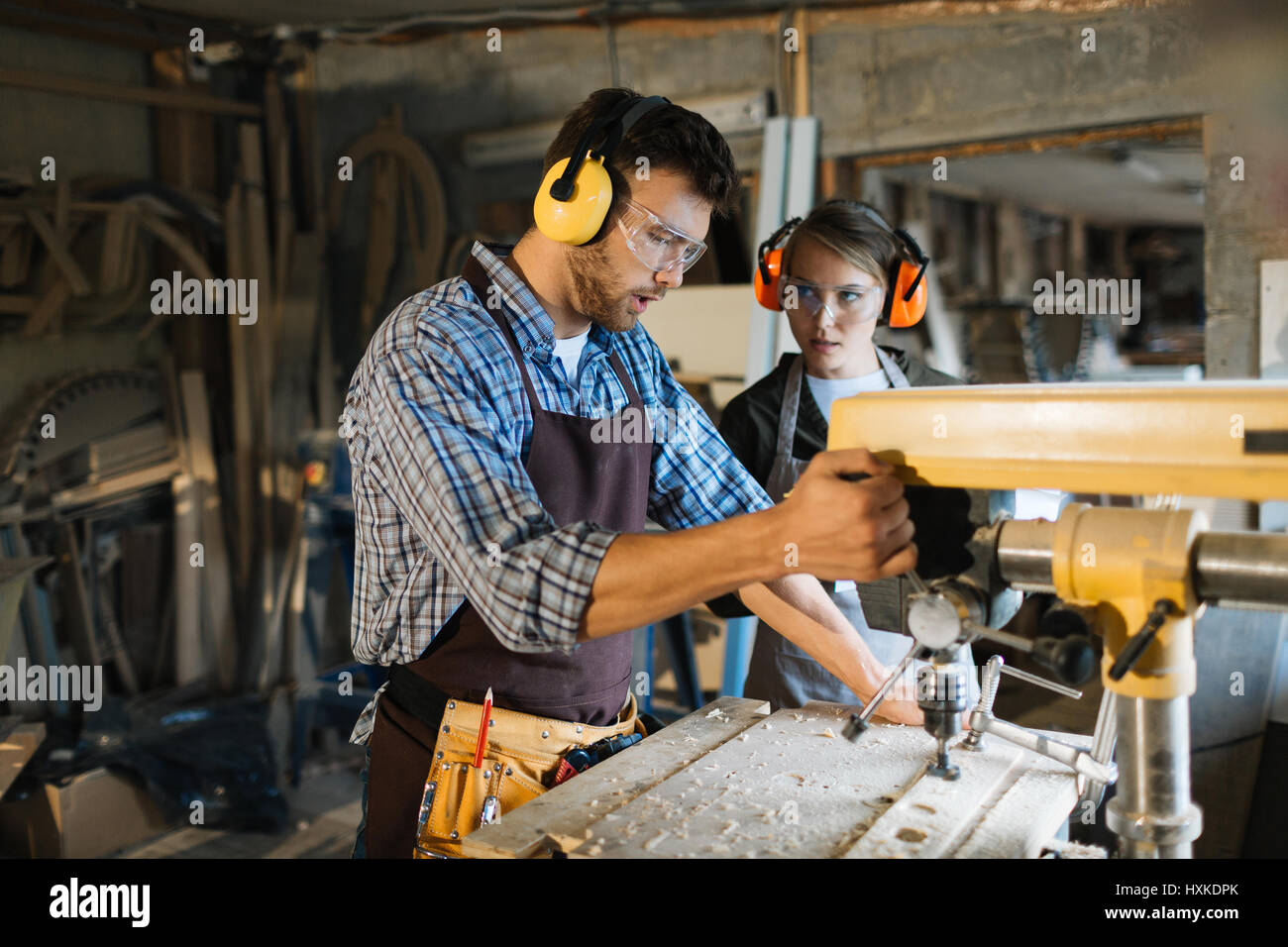 Teaching apprentice to use drill press Stock Photo - Alamy