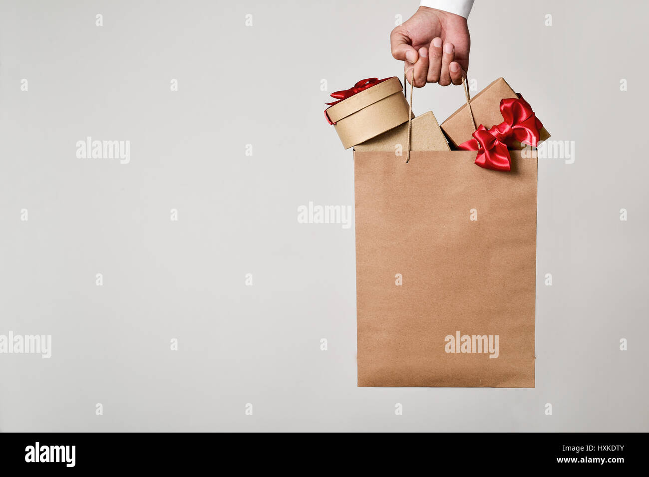 Man carrying gift boxes hi-res stock photography and images - Alamy