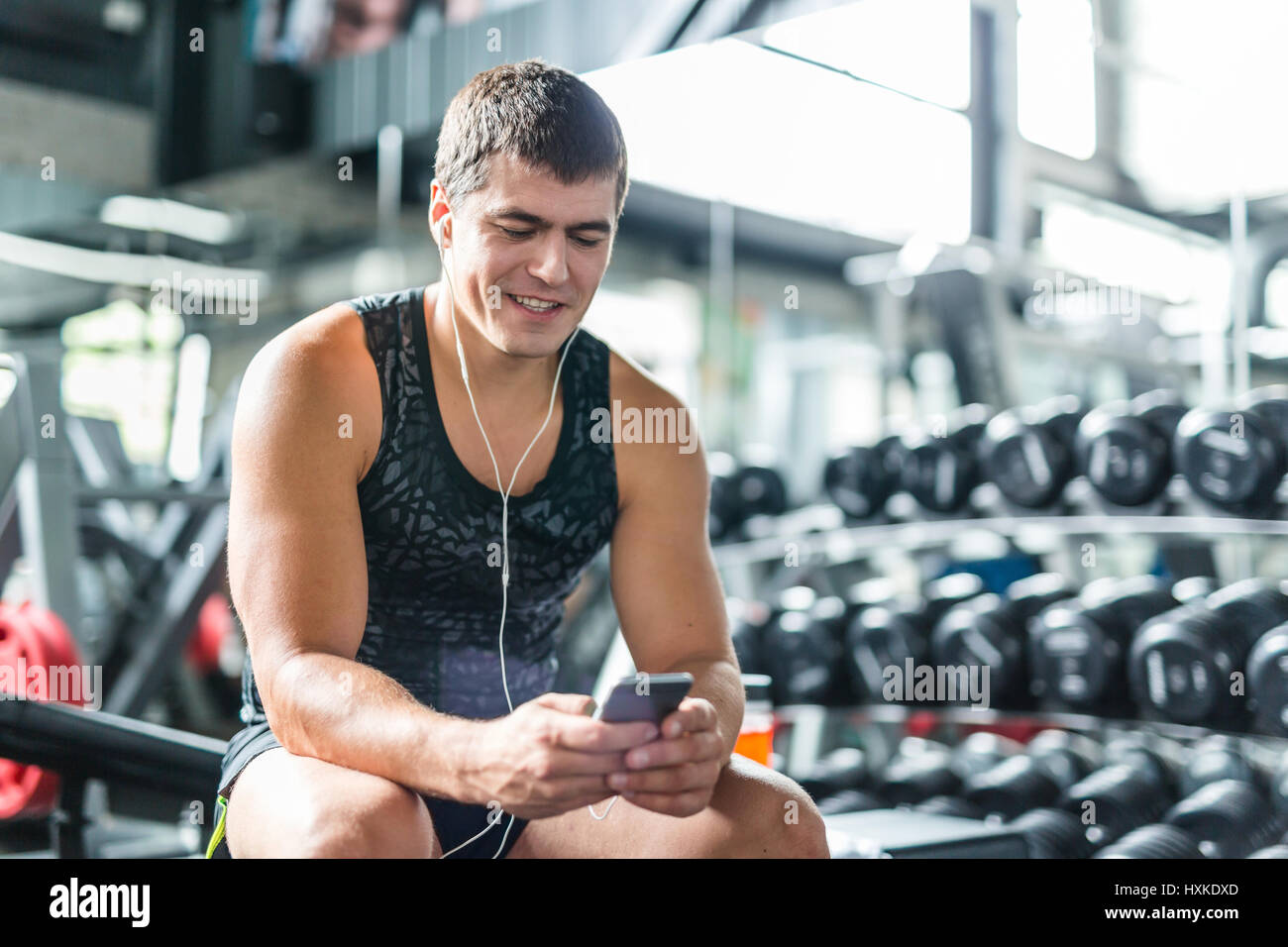 Strong Man Listening to Music in Gym Stock Photo - Alamy