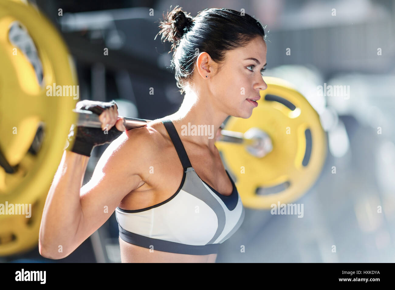 Brunette Muscular Woman Weightlifting Bar Stock Photo - Alamy