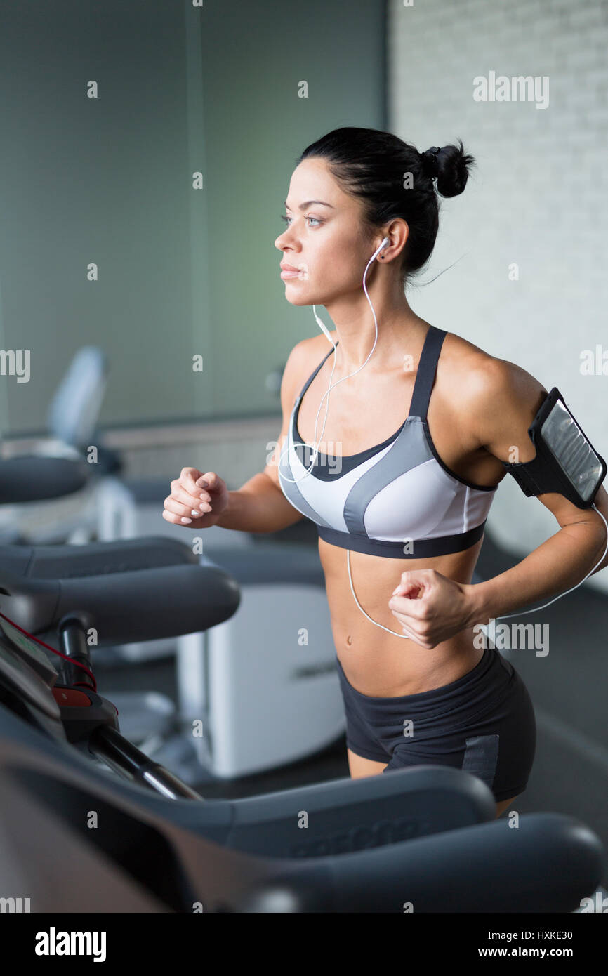 Young Fit Woman Exercising on Treadmill in Gym Stock Photo - Alamy