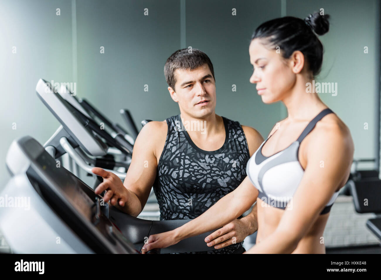 Personal trainer showing training hi-res stock photography and images ...