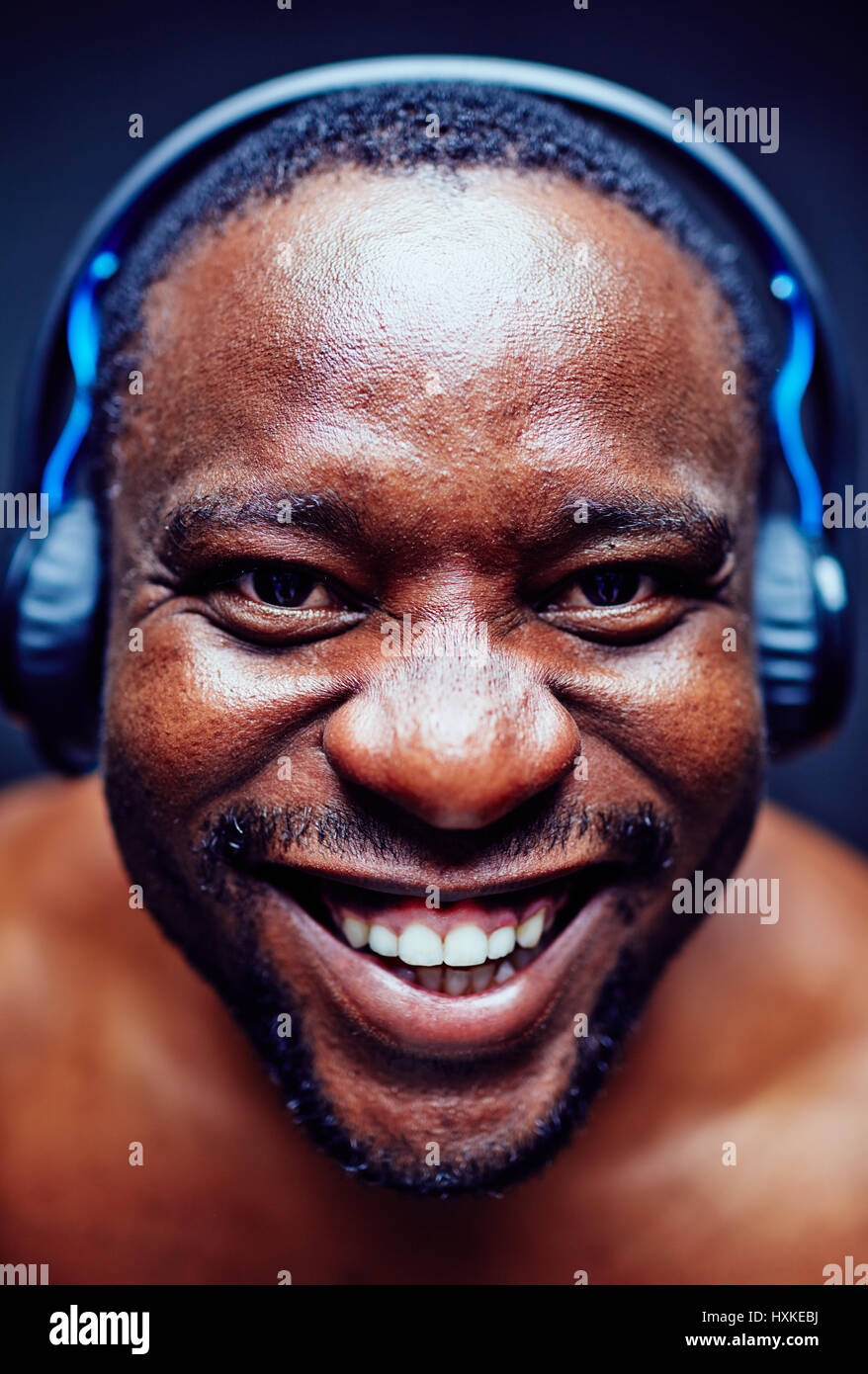 Headshot of cheerful music lover Stock Photo - Alamy