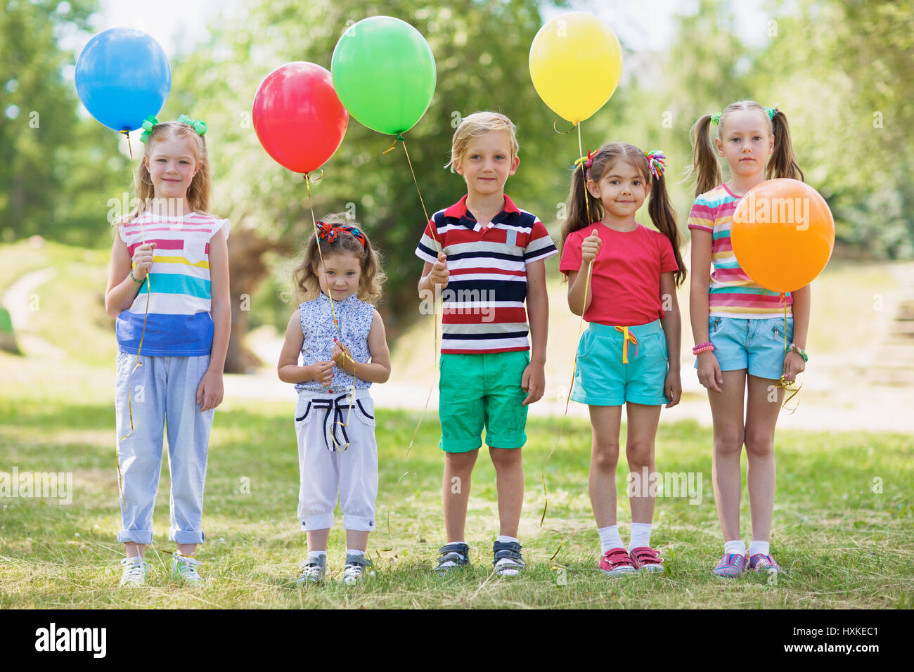 Kids with balloons Stock Photo - Alamy