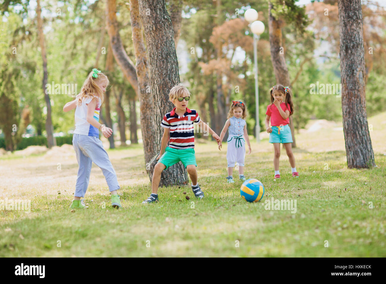 Children playing football Stock Photo - Alamy