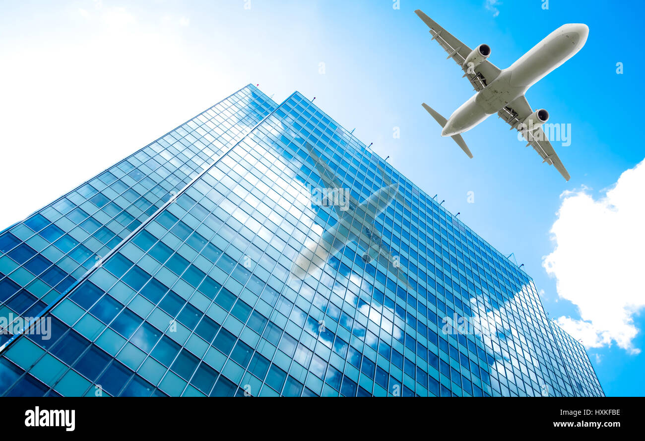 aeroplane flying over the skyscrapers. architecture building with ...