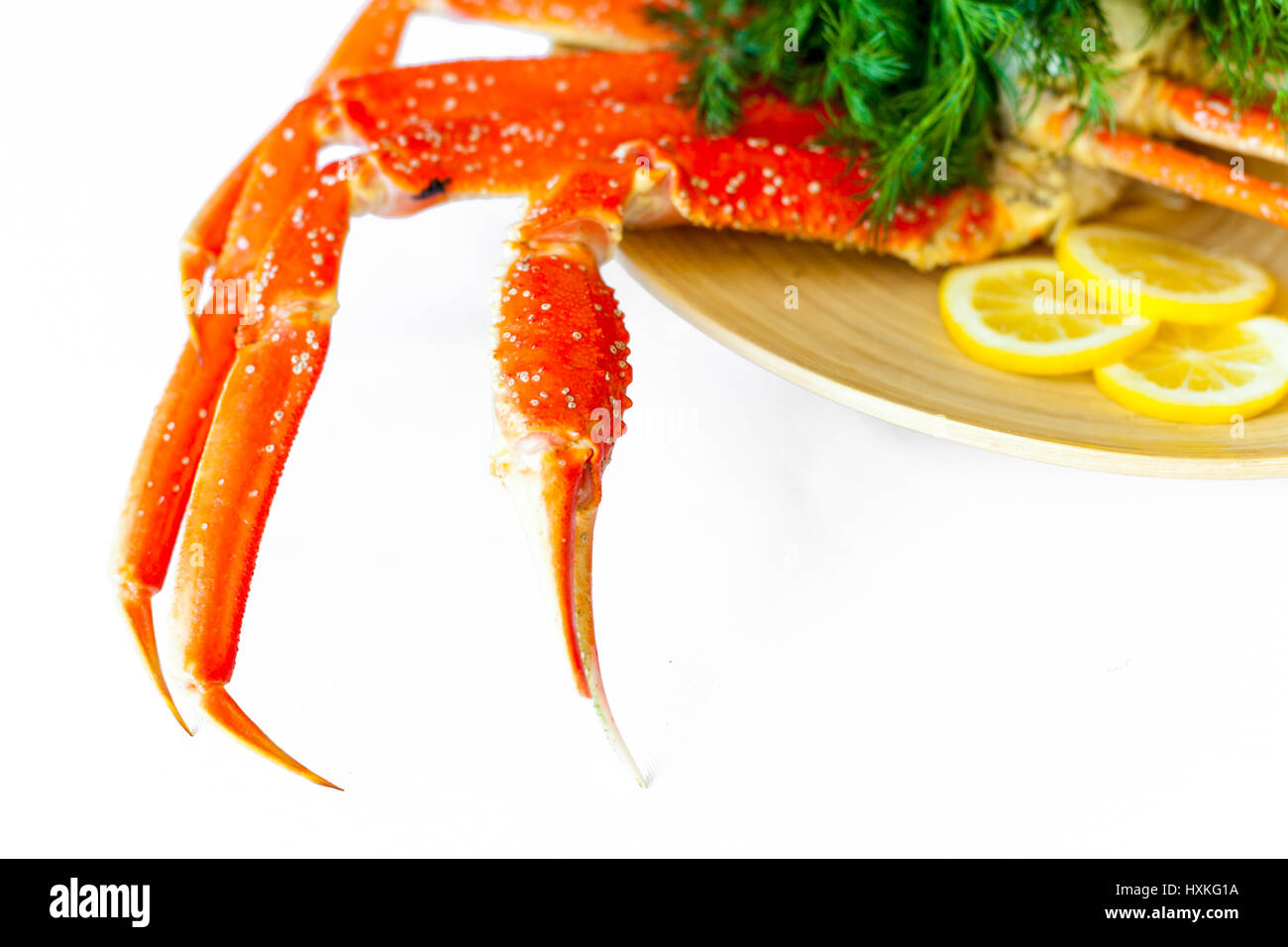 crab legs with lemon on a plate. Steamed crab Stock Photo - Alamy