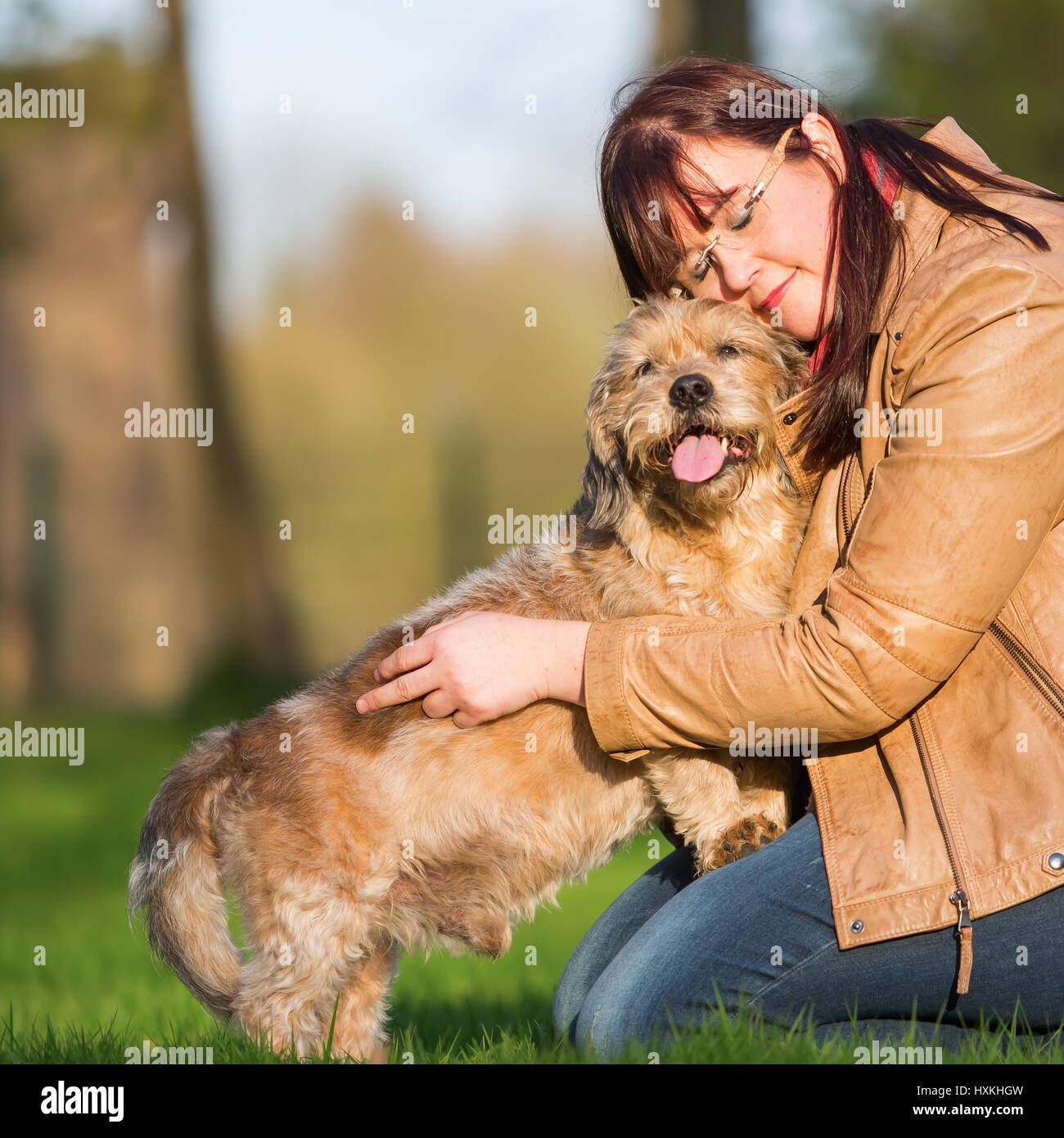 picture of a young woman cuddling with a cute dog Stock Photo - Alamy
