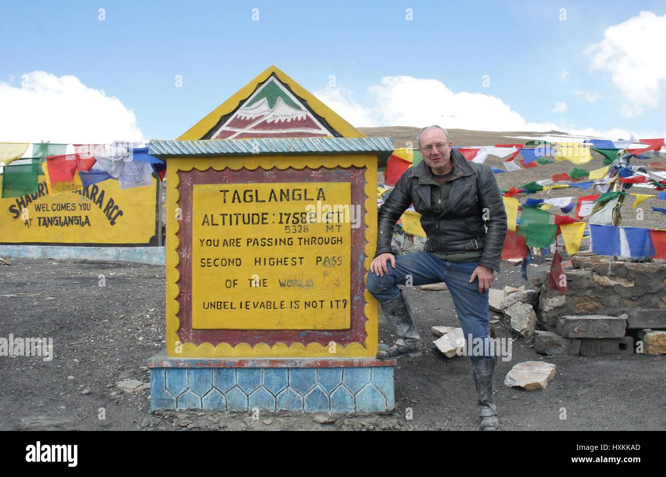 A photo of a motorcyclist at the second highest motorable pass in the ...