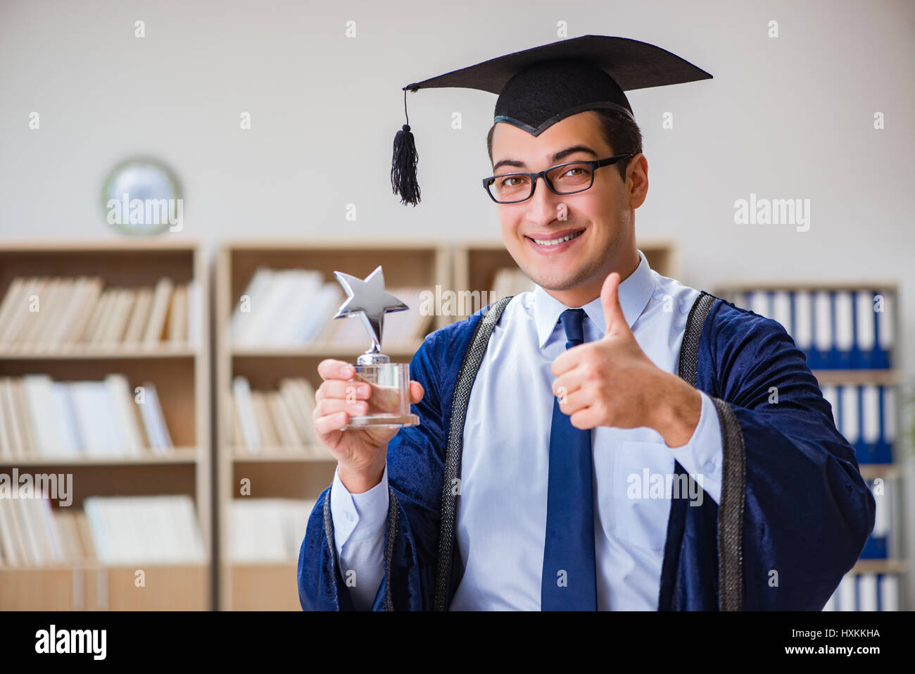 Young man graduating from university Stock Photo - Alamy