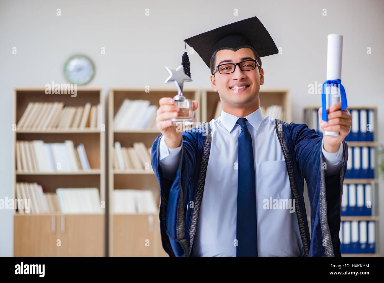 Young man graduating from university Stock Photo - Alamy