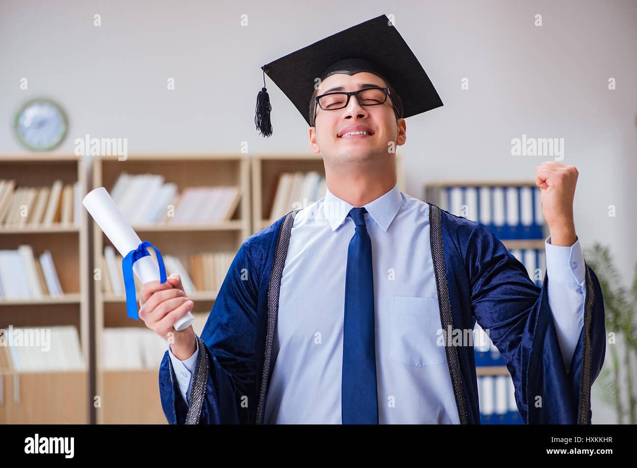 Young man graduating from university Stock Photo - Alamy