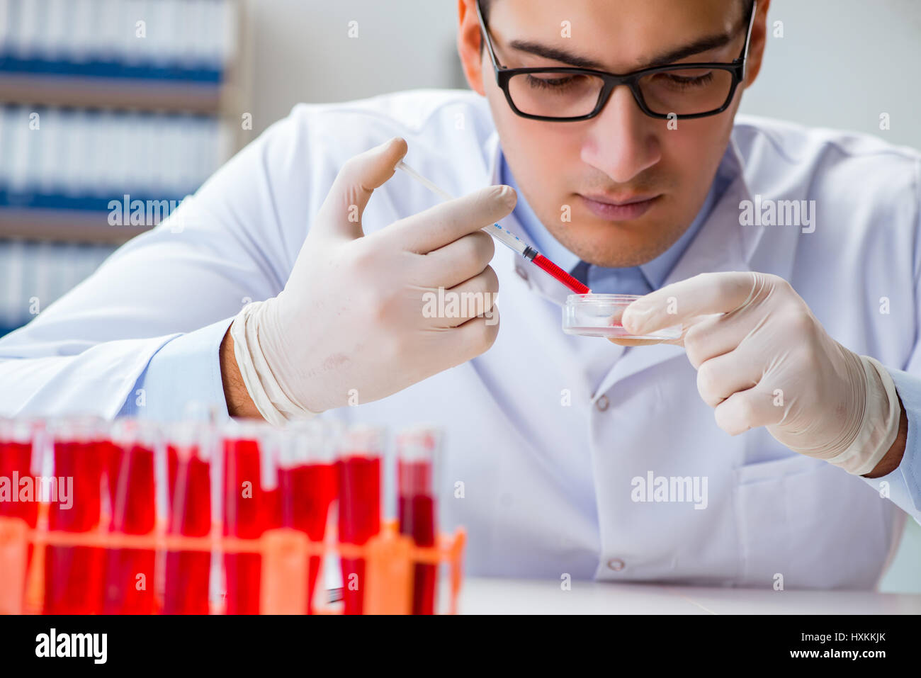 Doctor working with blood samples Stock Photo - Alamy