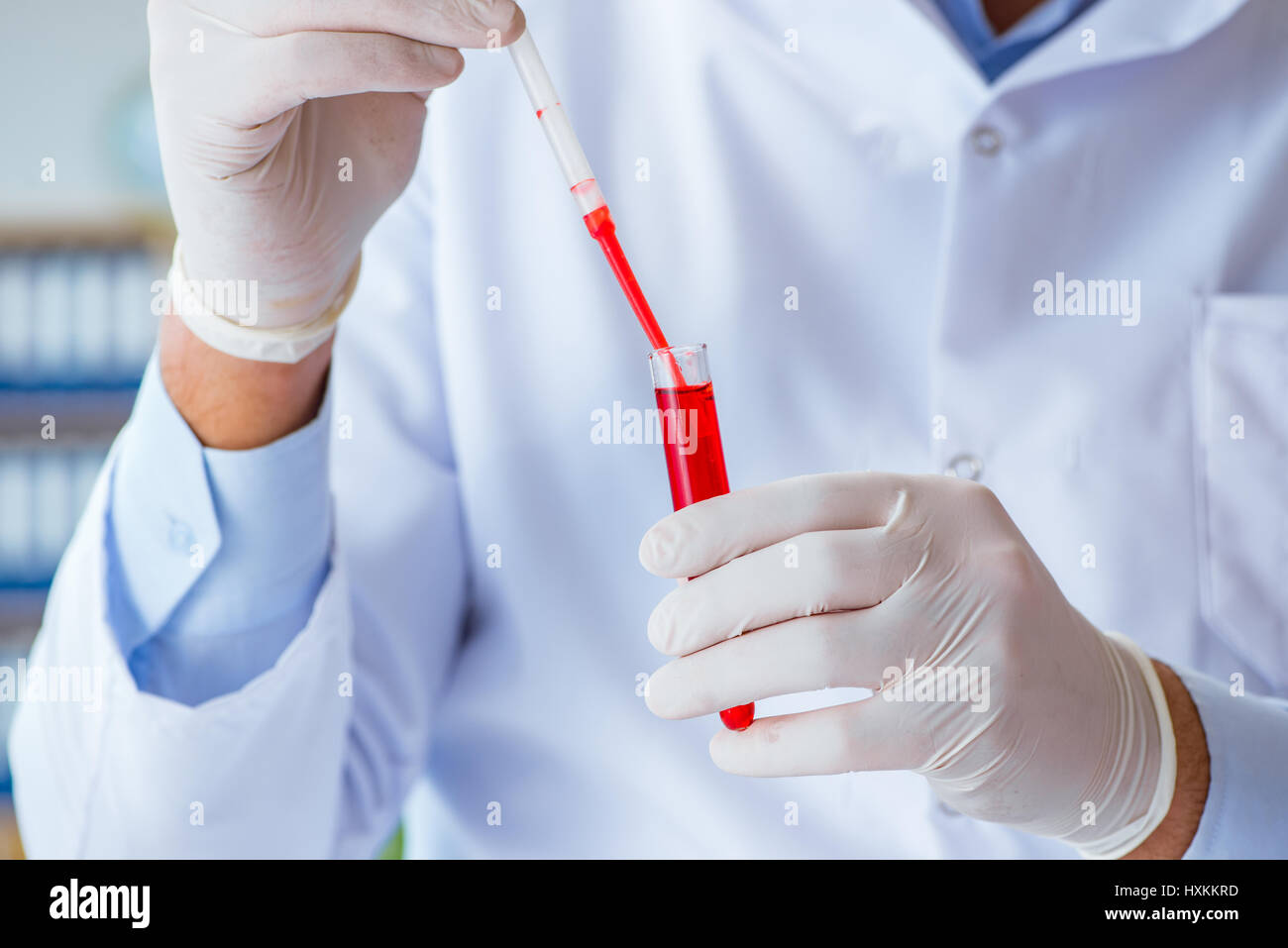 Young doctor working on blood test in lab hospital Stock Photo - Alamy