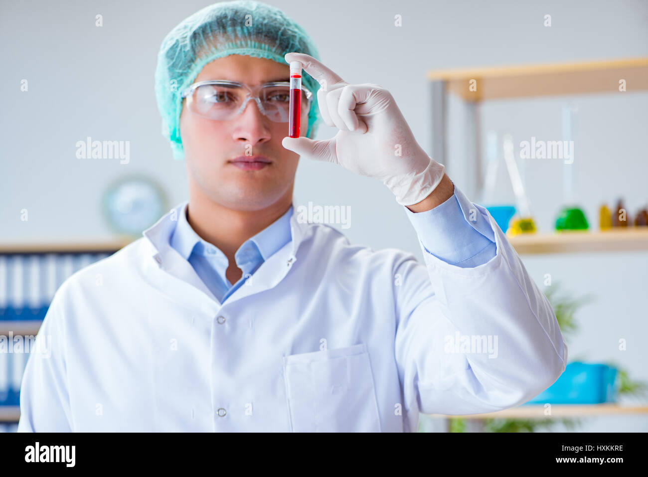 Young doctor working on blood test in lab hospital Stock Photo - Alamy