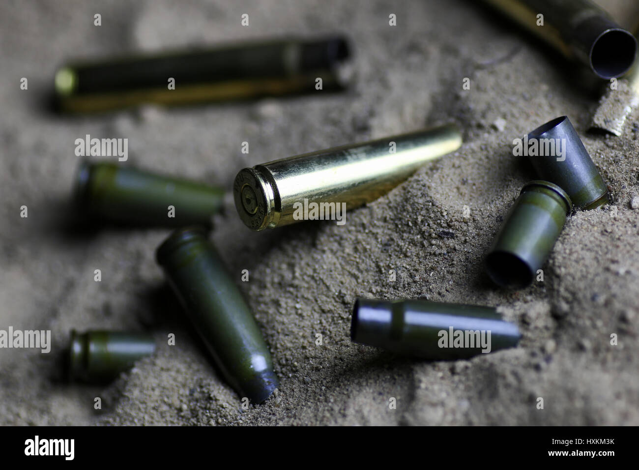 bullet in the sand Stock Photo - Alamy