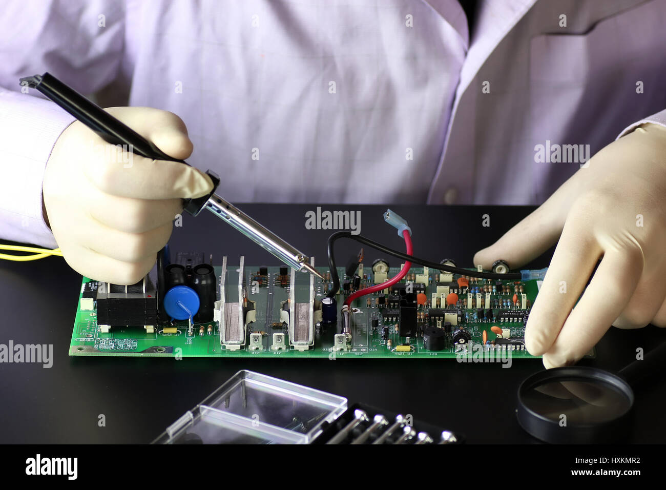 chip soldering man hands Stock Photo - Alamy