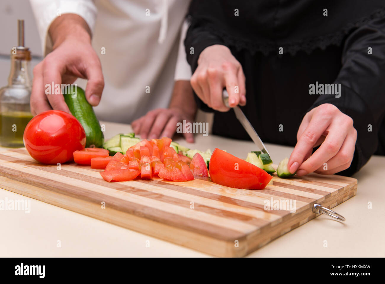 Young arab family in the kitchen Stock Photo - Alamy